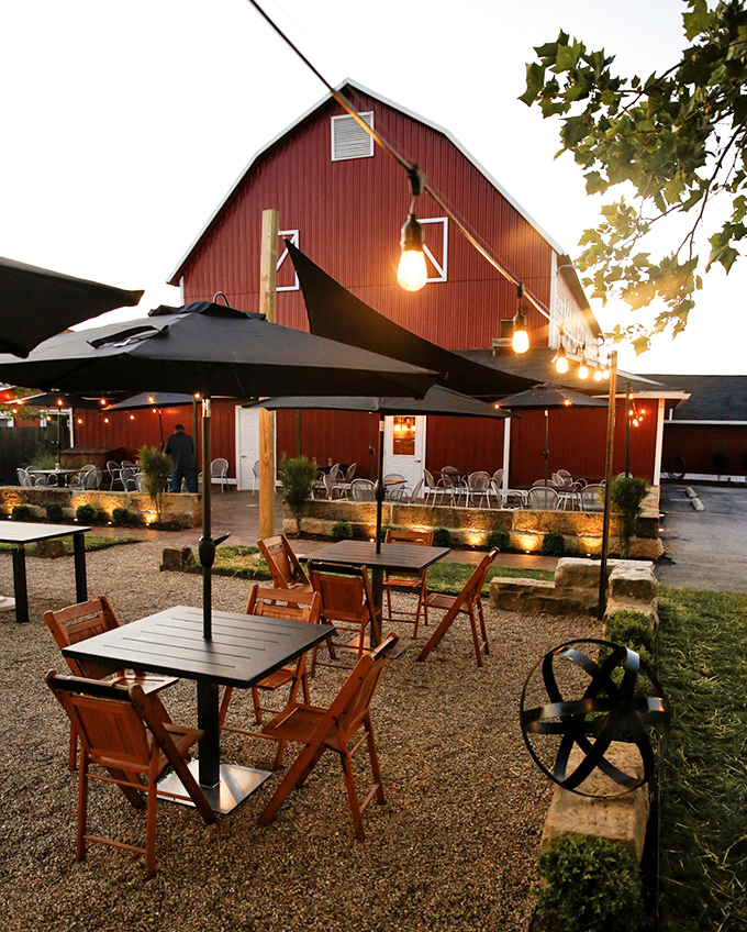 As dusk falls, the outdoor patio transforms into a magical space where string lights twinkle and dinner conversations flow as easily as the wine.