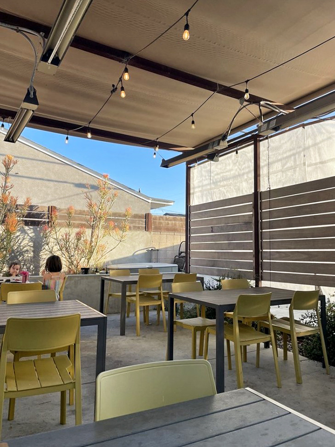 The outdoor patio &ndash; where string lights, yellow chairs, and LA sunshine create the perfect backdrop for your food coma recovery.