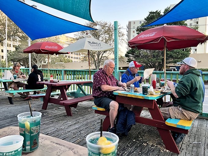 The outdoor seating area where vacation time slows down and conversations flow as freely as the sweet tea. Some of the best memories are made at these weathered picnic tables.
