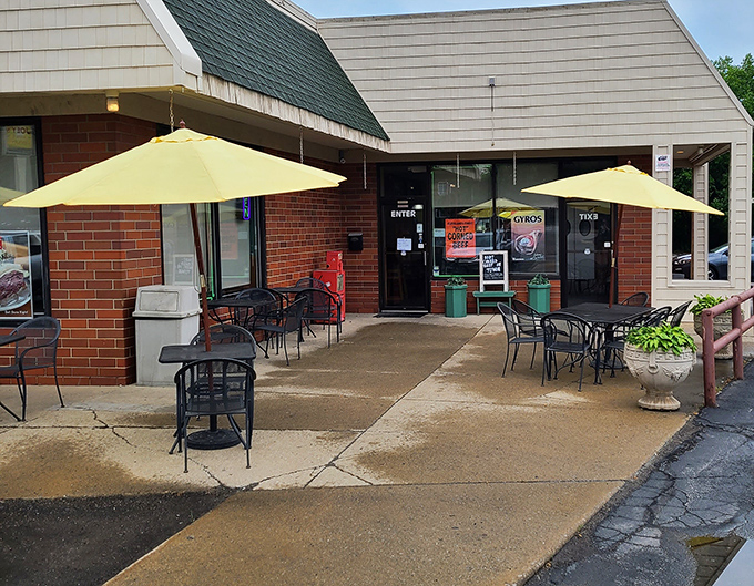 Yellow umbrellas beckon like culinary lighthouses, promising a pleasant outdoor dining experience at this neighborhood treasure.