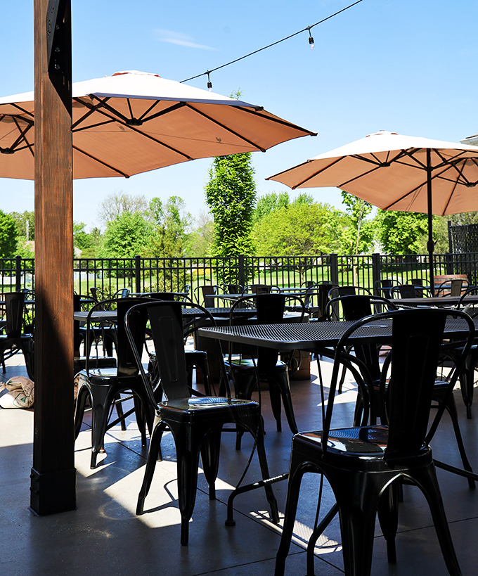 The outdoor seating area basks in Pennsylvania sunshine, offering the perfect backdrop for an afternoon of craft beer and exceptional food.