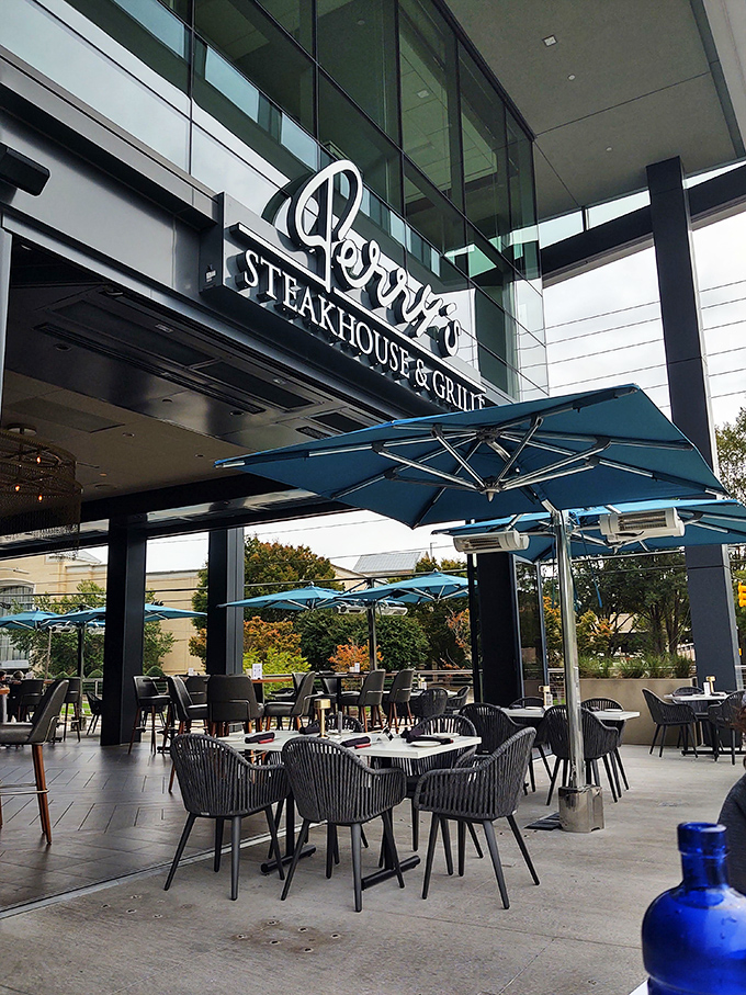 Outdoor dining that makes weather forecasts suddenly very important. Blue umbrellas, comfortable seating, and fresh air enhance the Perry's experience.
