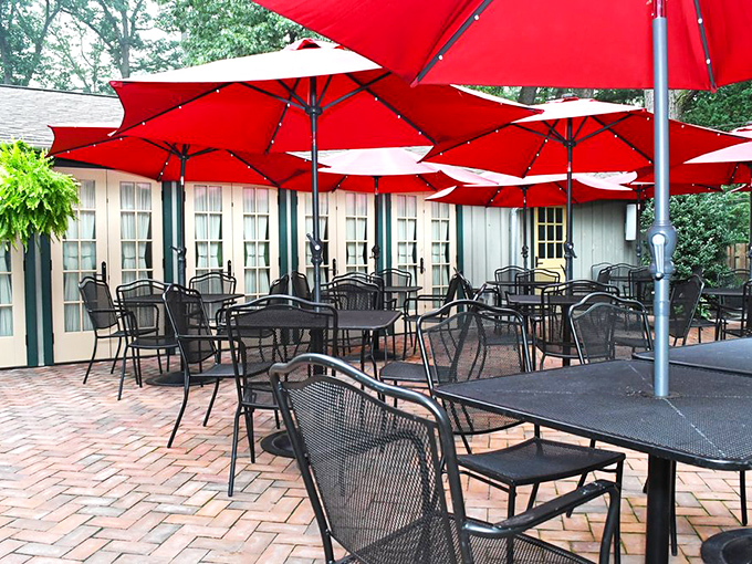 The outdoor seating area, with its cheerful red umbrellas, offers al fresco dining that makes Pennsylvania summers feel like a European holiday.