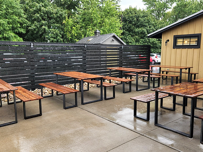 The outdoor seating area—where summer evenings transform simple picnic tables into the best restaurant "view" in town.