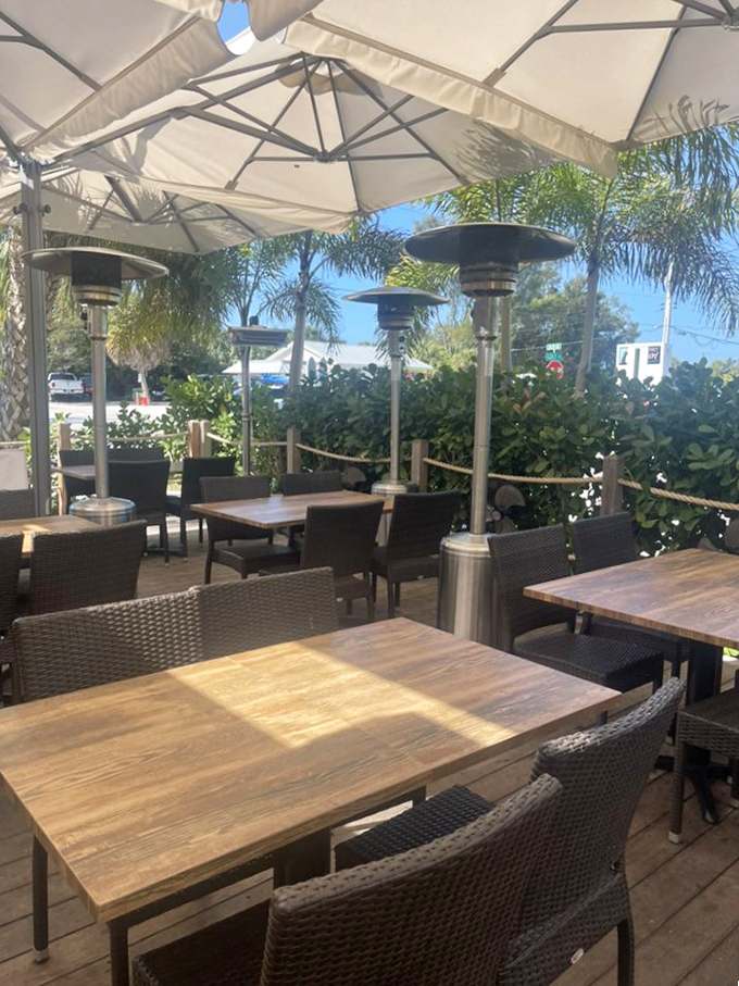 Outdoor dining that captures the essence of Florida living—palm trees, gentle breezes, and heat lamps for those "chilly" 70-degree evenings.