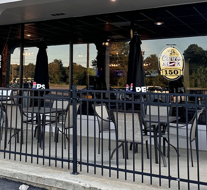 The outdoor patio &ndash; where fresh air meets fresh food. Simple metal tables invite you to enjoy your meal under the South Carolina sky.