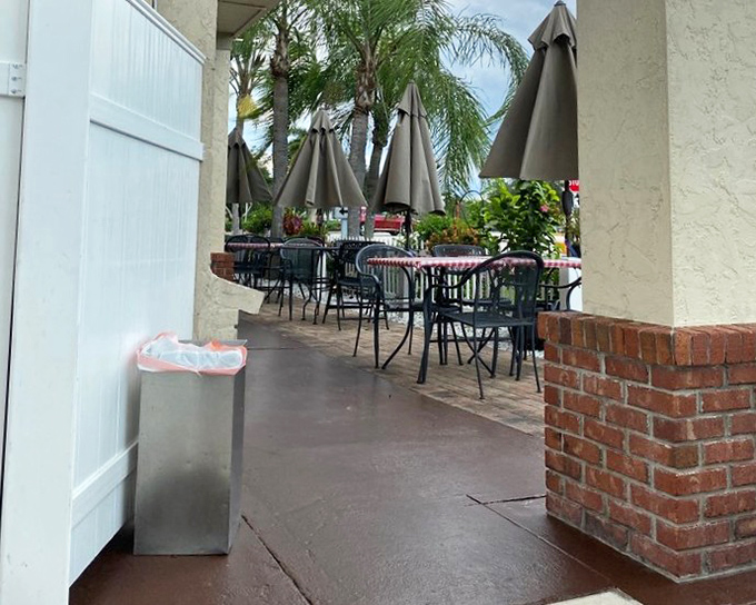 Palm trees and patio umbrellas frame the outdoor dining space, where you can enjoy your Joe's favorites while soaking up that famous Naples weather.