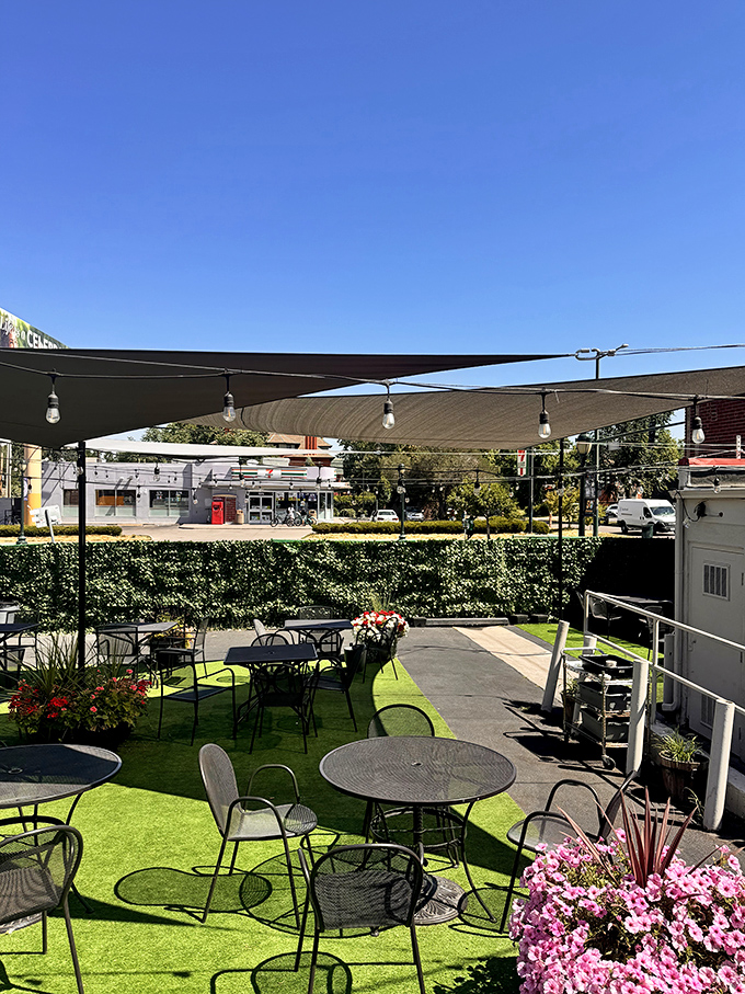 The outdoor patio—where fresh air meets comfort food. Those pink flowers don't just survive in Colorado's climate; they thrive, just like Pete's Kitchen.