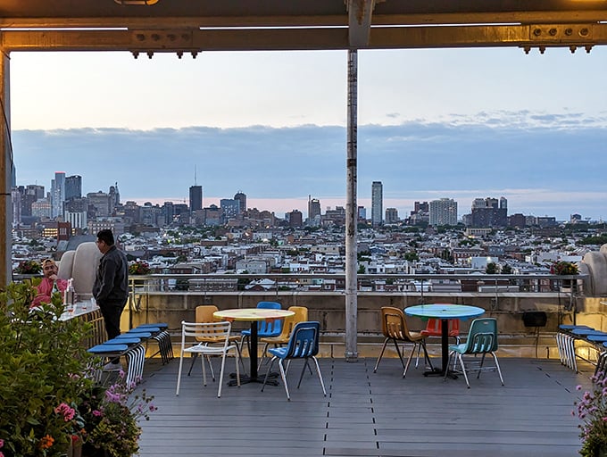 Sunset dining at its finest. The Philadelphia skyline provides a cinematic backdrop for Irwin's outdoor tables, where city lights replace candles after dusk.