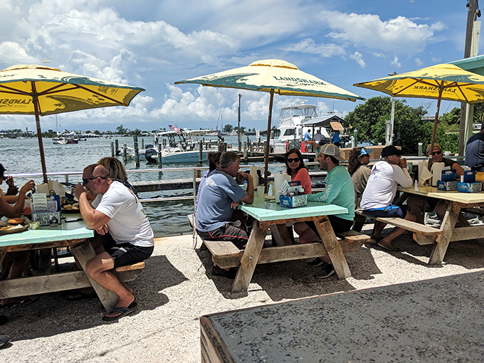 Outdoor seating where Gulf breezes and water views transform every meal into a memorable coastal experience.
