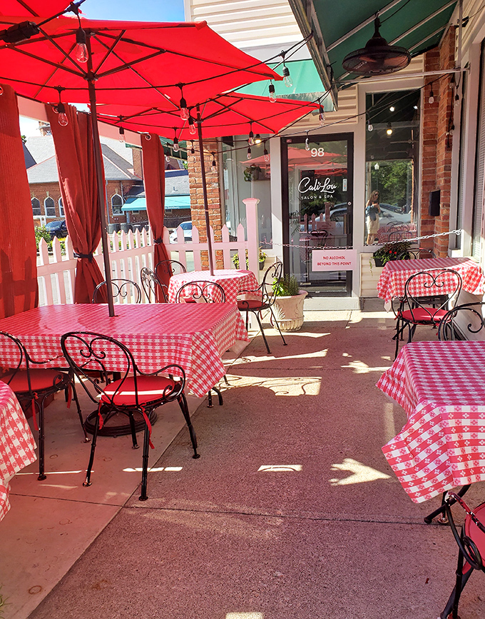 Outdoor seating with those signature red-checkered tablecloths extending the Italian experience into the sunshine. Al fresco dining, Columbus-style.