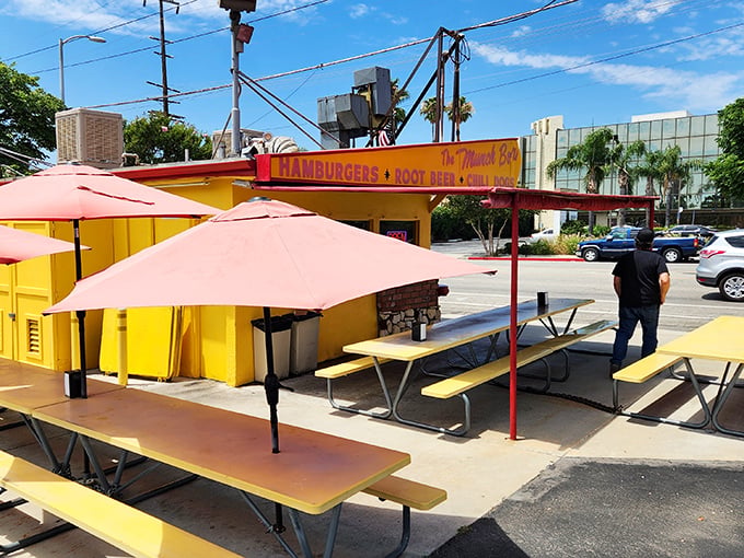 Yellow picnic tables under coral umbrellas create the perfect setting for enjoying a perfect burger on a perfect California day. Life doesn't get better.