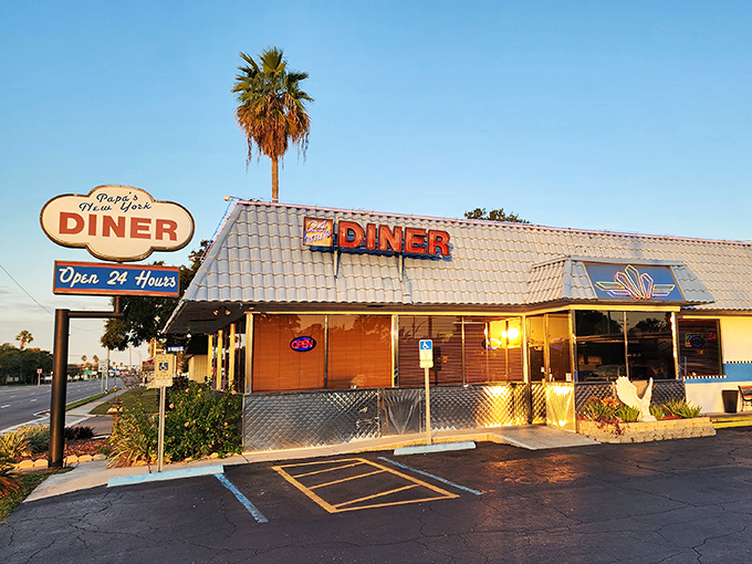 Sunset casts a golden glow on Papa's exterior, transforming an everyday diner into something magical. Palm trees included at no extra charge.