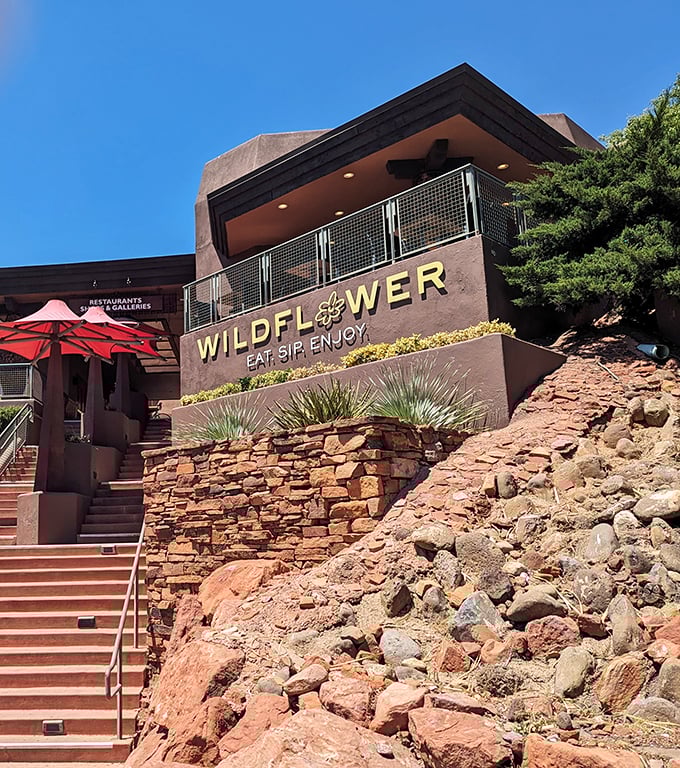 "Eat. Sip. Enjoy." Three perfect instructions for approaching life, perched majestically against Sedona's iconic red rocks. The stone staircase invites you to culinary adventure.