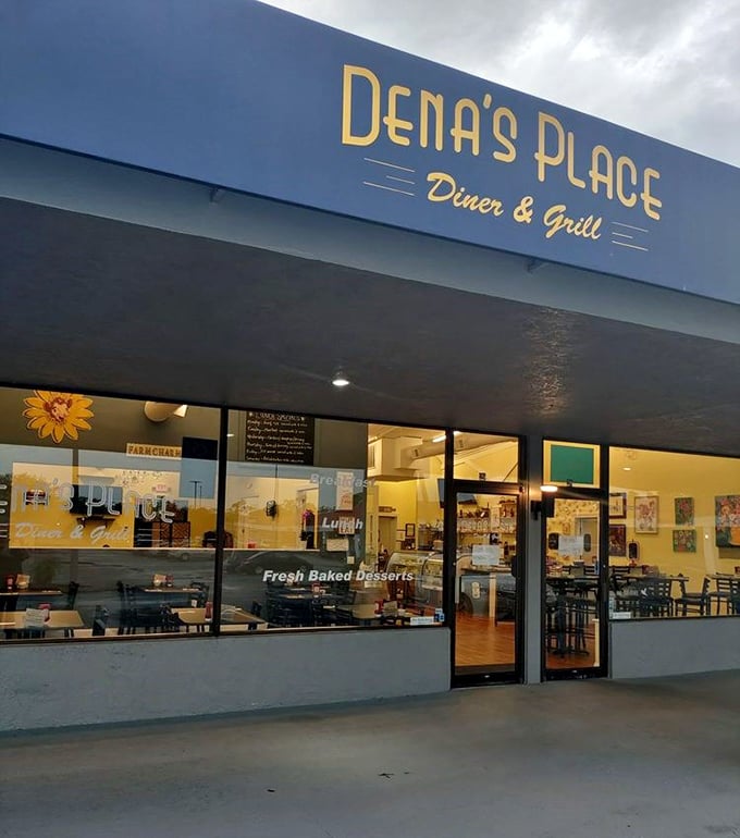 As evening approaches, Dena's Place glows with welcome. The "Fresh Baked Desserts" promise in the window is the culinary equivalent of "And they lived happily ever after."