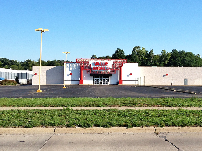 Value World's exterior basks in Michigan sunshine, its red signage a beacon for bargain hunters across Wayne County. Thrift paradise awaits inside.