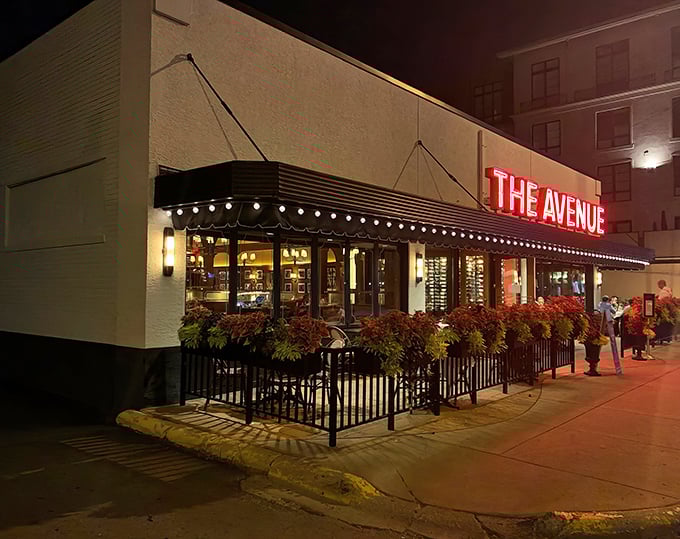 As evening falls, The Avenue's red neon glow becomes a beacon for those seeking refuge from ordinary dining experiences.