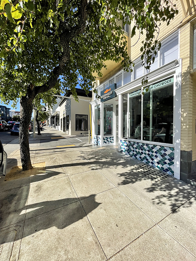 From the sidewalk, Woodhouse Fish Co. blends into the neighborhood landscape while the blue-tiled facade and signature red fish logo offer subtle hints of seafood excellence within.