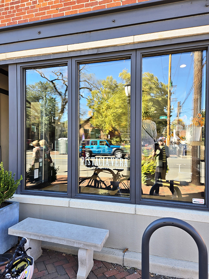The welcoming storefront window reflects both German Village charm and your imminent surrender to pastry perfection.