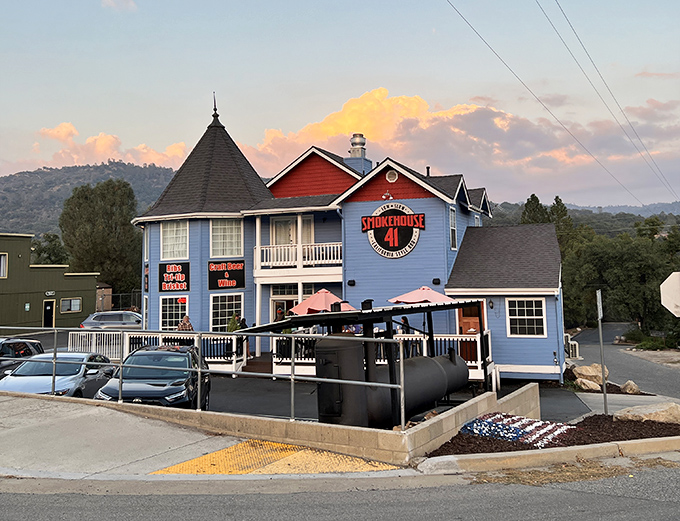 As the sun sets behind the Sierra foothills, Smokehouse 41's blue exterior glows like a barbecue lighthouse guiding hungry travelers home.
