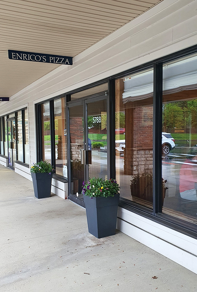 Those planters flanking the entrance aren't just decorative&mdash;they're the first hint that someone inside cares about details. Good food always begins with caring.