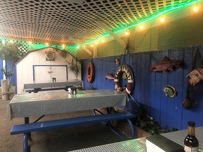 A few simple tables outside for those who prefer their fish and chips with a side of fresh air. Sometimes the best dining rooms have no ceiling.