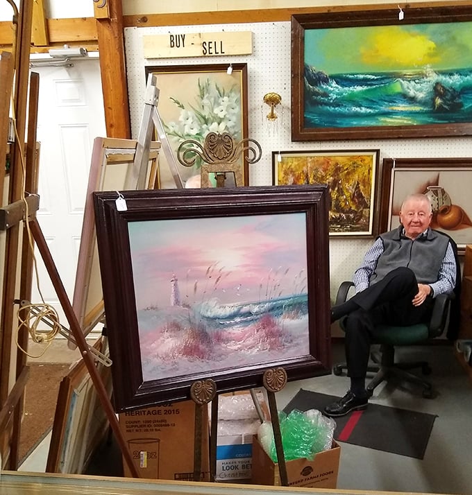 Art gallery meets living room in this eclectic painting display. Where else can you find seascapes, still lifes, and a comfortable chair for contemplating your next purchase?
