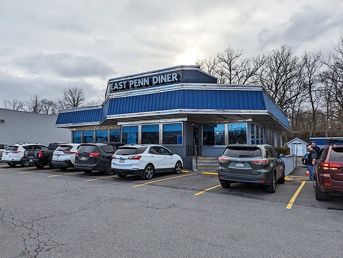 Even on cloudy days, the East Penn Diner's distinctive silhouette draws a steady stream of regulars and first-timers seeking comfort food salvation.