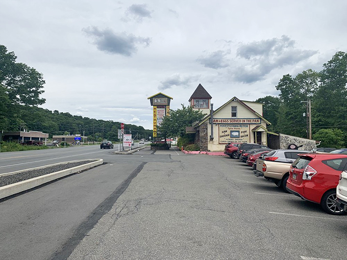 The parking lot view reveals the restaurant's perfect Pocono Mountains setting. Your car knows it's about to be filled with happy, well-fed passengers.