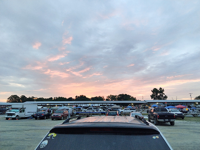 Sunset over shopping paradise. As day turns to dusk, the Big D Flea Market's silhouette reminds us that tomorrow brings new treasures and possibilities.