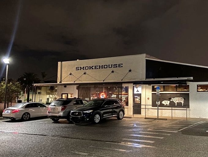 Even at night, the glow of 4 Rivers Smokehouse calls to barbecue lovers like a lighthouse guiding hungry sailors to safe, delicious harbor.