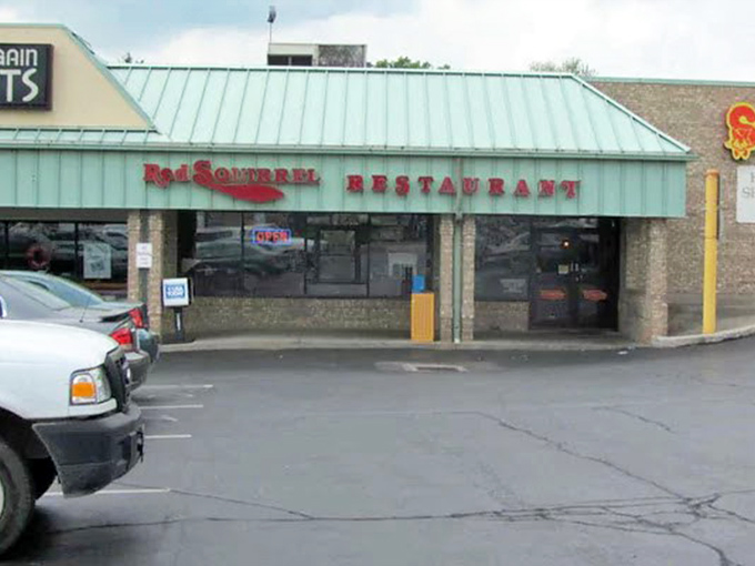 From the parking lot, that Red Squirrel sign promises the same thing it always has: honest food served with Midwestern hospitality.