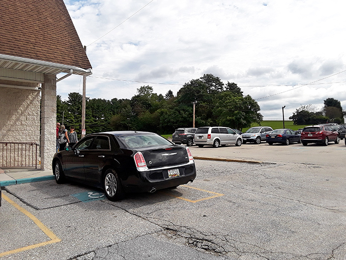 A parking lot that tells the real story&mdash;packed with vehicles from work trucks to sedans, because good food crosses all demographic lines.