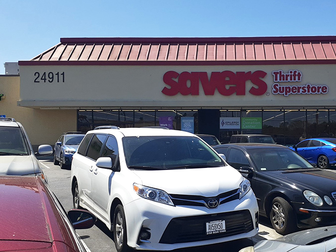 The parking lot view reveals the store's address and a row of cars belonging to treasure hunters currently mining for deals inside.