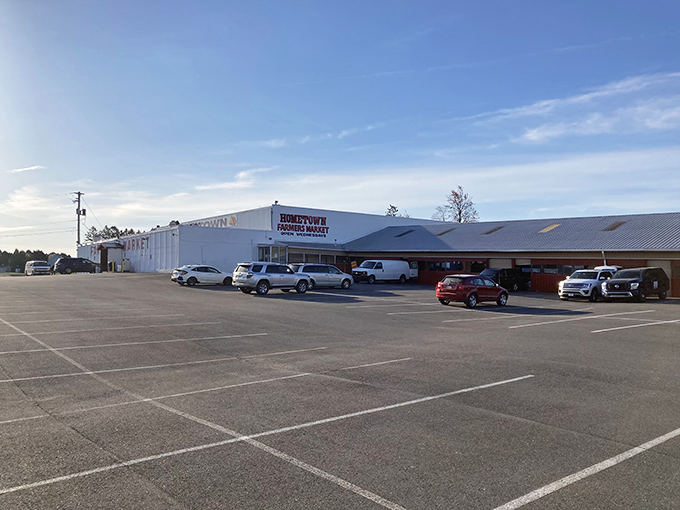 The unassuming exterior of Hometown Farmers Market &ndash; Pennsylvania's temple of treasures hiding in plain sight, with a parking lot that fills before dawn.