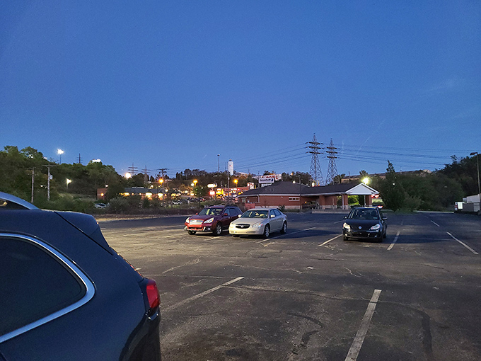 As dusk settles over the parking lot, dedicated shoppers make their final pilgrimages of the day, cars loaded with treasures and wallets barely lightened.