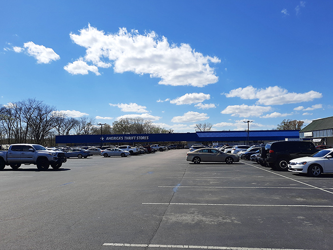 The parking lot stretches wide under Alabama skies, testament to the universal truth that everyone loves a good bargain.