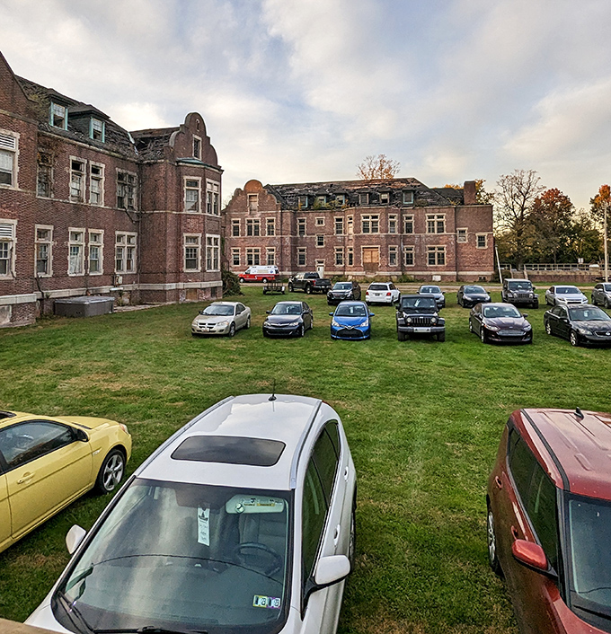 Today's parking lot was yesterday's institutional grounds, with visitors now coming by choice to a place many once couldn't leave.