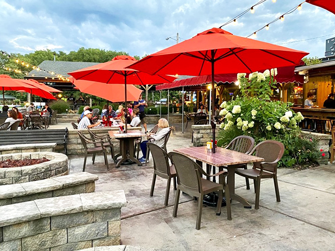 Summer perfection under red umbrellas. The patio doesn't just offer outdoor seating&mdash;it offers the soundtrack of laughter and clinking glasses.