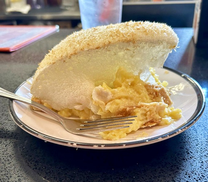 This isn't just coconut cream pie; it's a cloud that somehow landed on your plate and decided to taste like heaven.