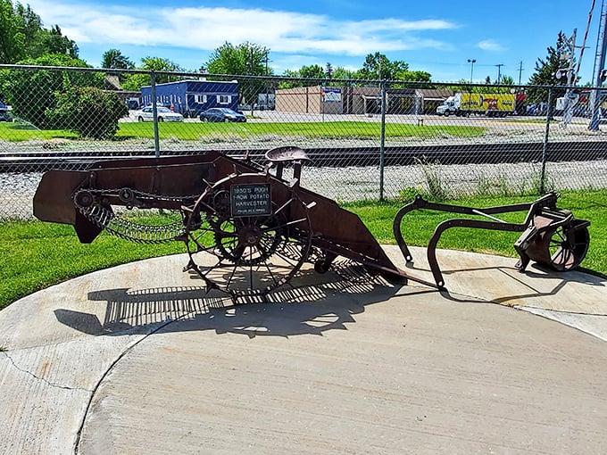 This antique potato harvester sits proudly outside, a rusty reminder of how far agricultural technology has come. Yesterday's innovation, today's museum piece.