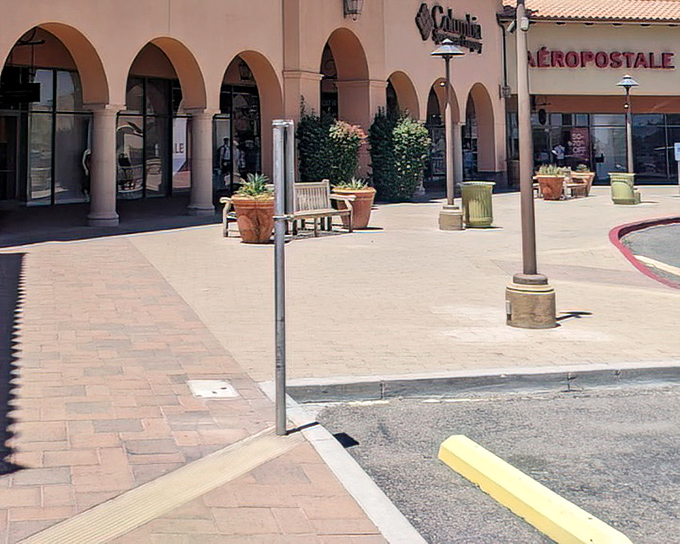 Arched entryways and terra cotta aesthetics remind shoppers they're still in Arizona, even while hunting for national brand bargains.