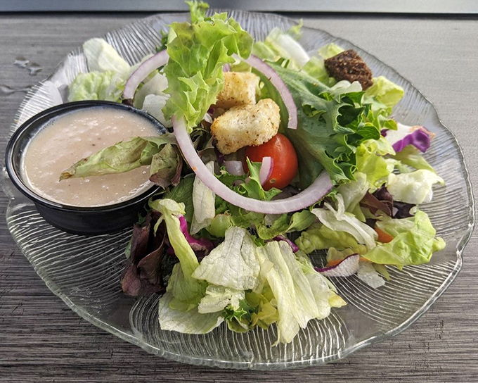 A simple house salad elevated to main character status with crisp greens and thoughtful accompaniments. Even salad skeptics might be converted.