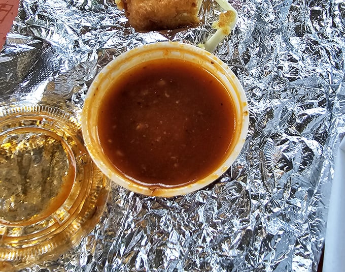 The secret weapons: dipping sauces that elevate already perfect food to supernatural heights. That gravy deserves its own James Beard Award.