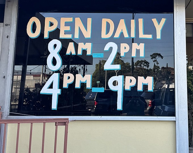 The hours posted clearly—because when you need pancakes or hot turkey, timing is everything. The midday break is for napping after breakfast.