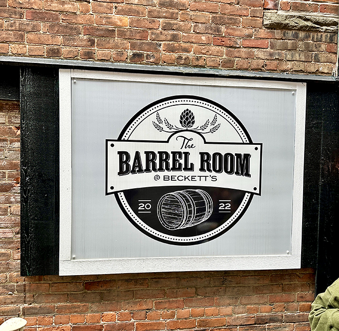 The Barrel Room sign announces itself with the quiet confidence of a place that knows exactly what it's about&mdash;good drinks and great times.