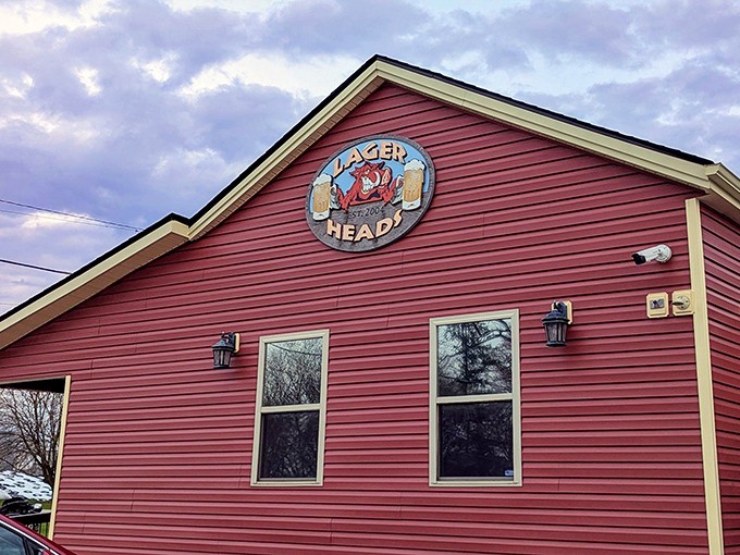 The sign that's launched a thousand road trips. That weathered logo promises smoky treasures within those red walls – a beacon for the barbecue faithful.