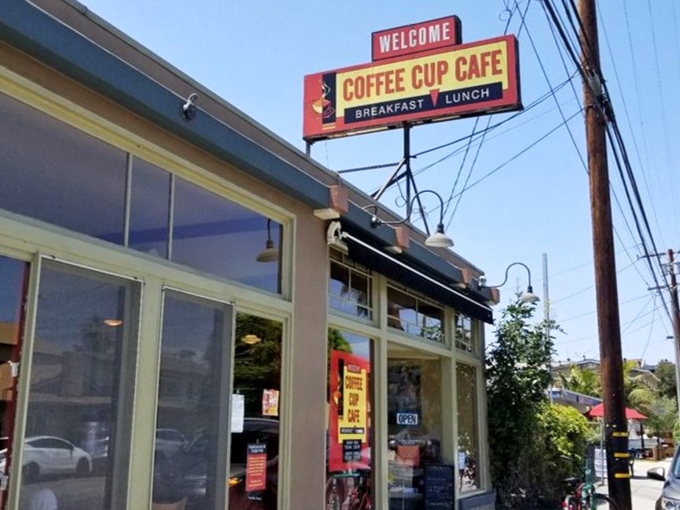 That vintage sign has been welcoming hungry souls longer than most restaurants have been alive.