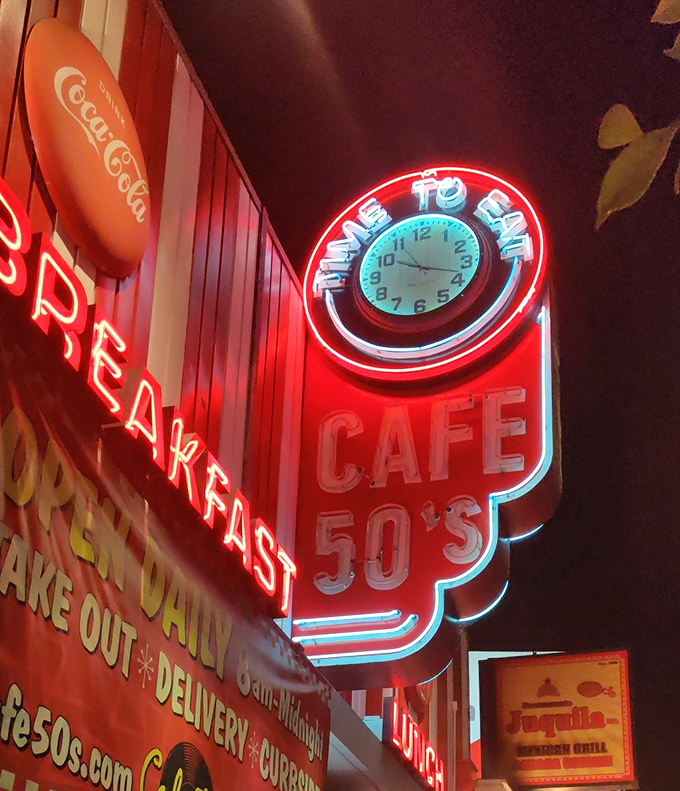 At night, the neon burns brighter than your hunger. That "Time to Eat" clock is always right, no matter what your watch says.