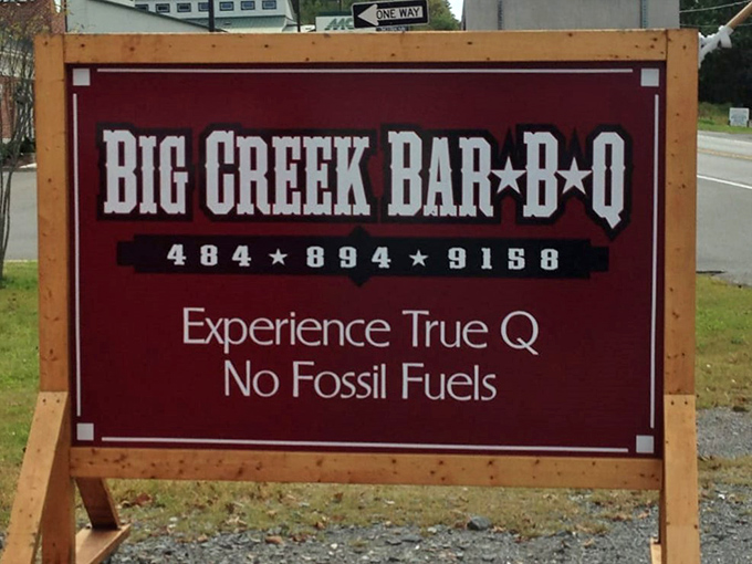 "Experience True Q, No Fossil Fuels"&mdash;a roadside promise that separates the authentic wood-smoking believers from the gas-assisted pretenders.
